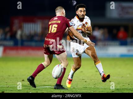 Tyrone May of Hull KR is tackled by Harry Robertson of St. Helens ...