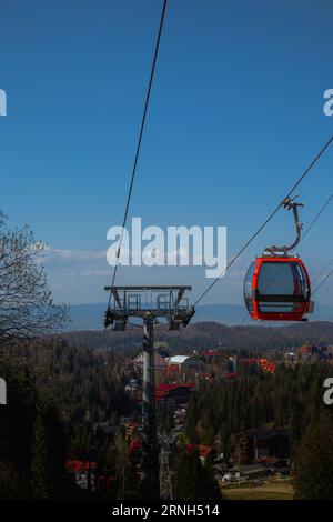 The cable car to the top of the mountains. Postavarul Peak from Poiana ...