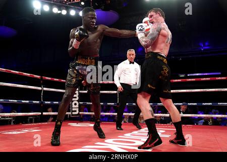 Samuel Antwi (left) strikes Mason Cartwright in the BBBofC British ...