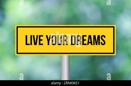 Dreams road sign on blur background Stock Photo - Alamy