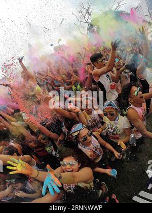 (170730) -- TAGUIG CITY (PHILIPPINES), July 30, 2017 -- Runners throw ...