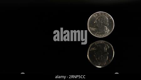 Quarter Dollar Coins Falling, Rolling and Sliding on Black Background ...