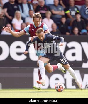 Tottenham Hotspur's James Maddison (right) salutes the fans following ...