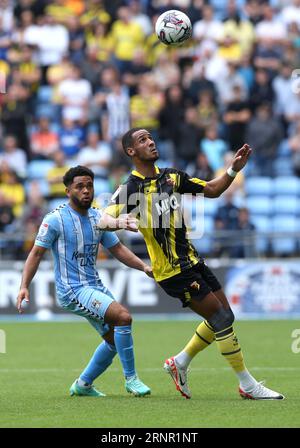 Watford's Thomas Ince (left) battle for the ball with Luton Town's ...