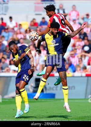 Bournemouth's Antoine Semenyo (right) battles with Arsenal's Piero ...