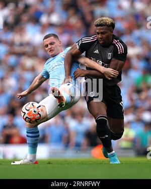 Fulham's Adama Traore and Manchester City's Ruben Dias (right) battle ...
