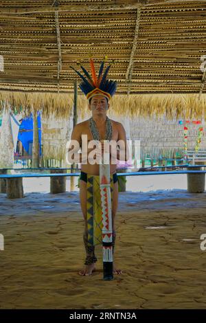 Tuyuca native man with a traditional great flute Music instrument ...