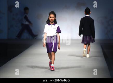 (171203) -- BEIJING, Dec. 3, 2017 -- Student models present school ...