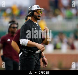 Texas State head coach GJ Kinne signals to his players during the first ...