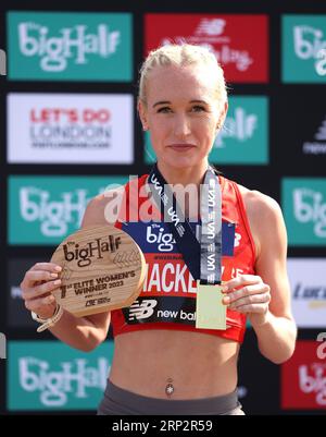 Calli Thackery with her trophy and medal for the Women's Elite race ...