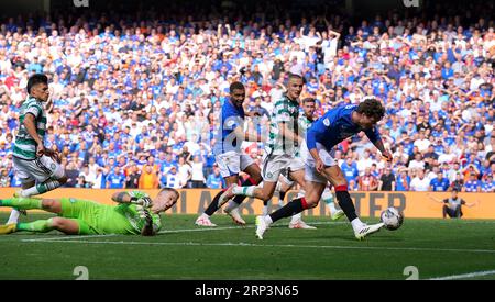 Rangers' Sam Lammers goes around Celtic goalkeeper Joe Hart before ...