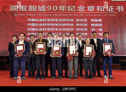 (181013) -- ANYANG, Oct. 13, 2018 -- A visitor takes photos of a bronze ...