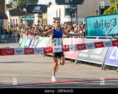 Jack Rowe crosses the finish line to win the Men's Elite race during ...