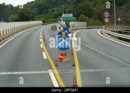 Road signs indicating the direction of movement, traffic lights with ...