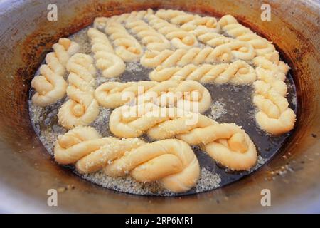 Mahua, a traditional Chinese food is fried in oil, North China Stock ...