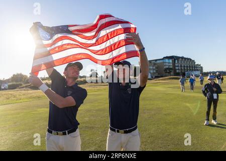 Nick Dunlap (left) and Austin Greaser of the USA on the 17th green as ...