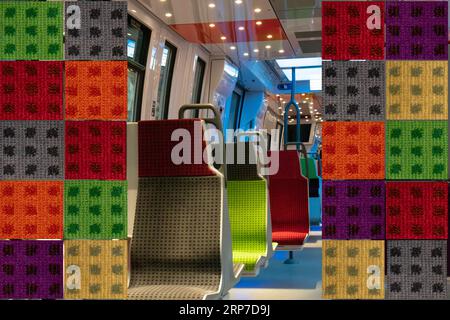 Colorful empty seats inside a Paris Metro train Stock Photo - Alamy