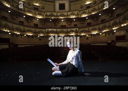 Female mime reading manuscript stage Stock Photo - Alamy