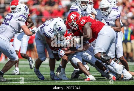 Northwestern Wildcats linebacker Xander Mueller (34) runs on the field ...