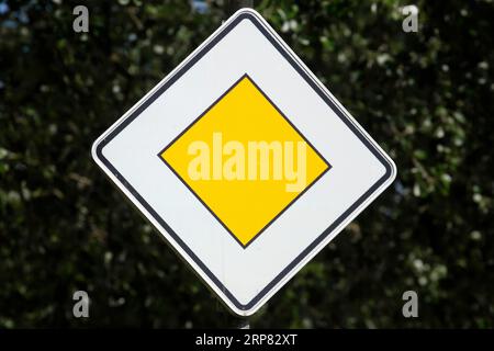 German road sign: right of way at the next crossroads Stock Photo - Alamy