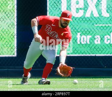 Philadelphia Phillies' Kyle Schwarber, right, celebrates as he crosses ...