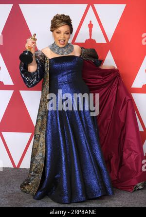 Ruth E. Carter poses with the Best Costume Design award for 'Black ...