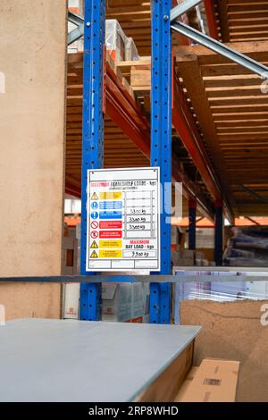 Safety recommendations sign attached to metal racking Stock Photo - Alamy