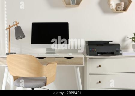 Stylish workplace with modern computer, printer and lamp Stock Photo ...