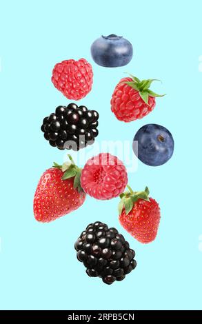 Fresh strawberries of the season, one whole and two half on a wooden ...