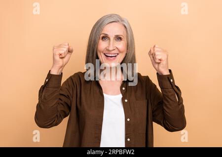Photo of excited glad lady raise two thumb up toothy smile wear violet ...