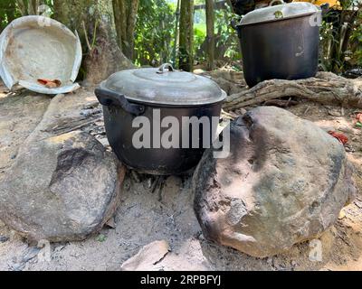 Traditional primitive Philippine style ground cooking using rocks and ...
