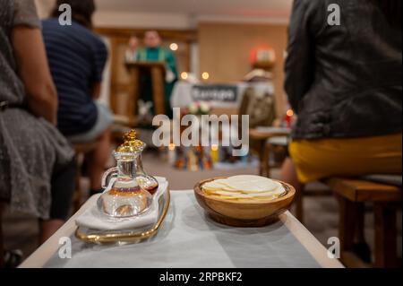 Priest offering bread and wine during mass Stock Photo - Alamy
