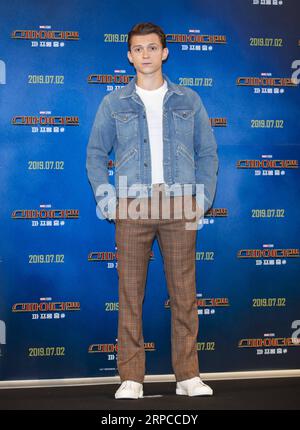 Tom Holland poses on the red carpet of the premiere for the movie ...