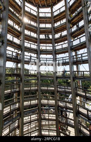 visitors walking inside the 40-meter-high observation tower, part of ...
