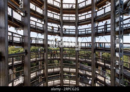 visitors walking inside the 40-meter-high observation tower, part of ...