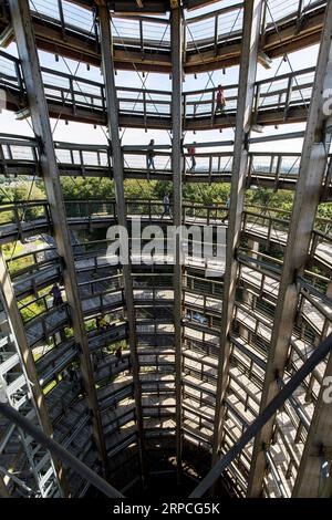 visitors walking inside the 40-meter-high observation tower, part of ...