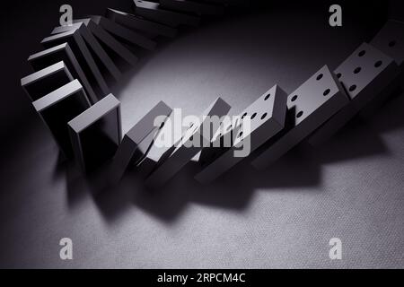 Domino loop falling in moody lighting creates intricate shadows and ...