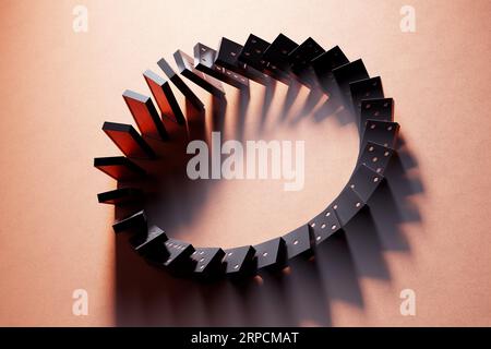 Domino loop falling in moody lighting creates intricate shadows and ...