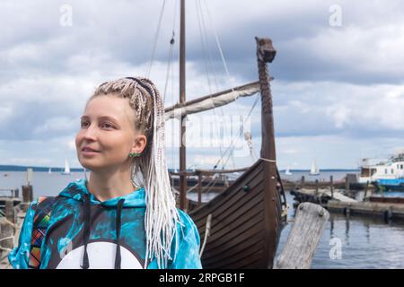 woman tourist went ashore after sailing in a modern replica of anсient ...