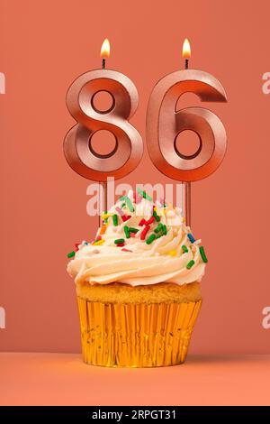 Candle number 86 - Cake birthday in rhodamine red background Stock ...
