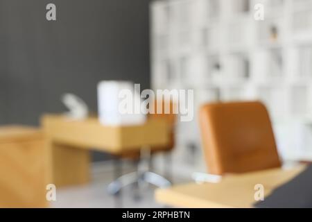 Blurred view of modern office with workplaces Stock Photo - Alamy