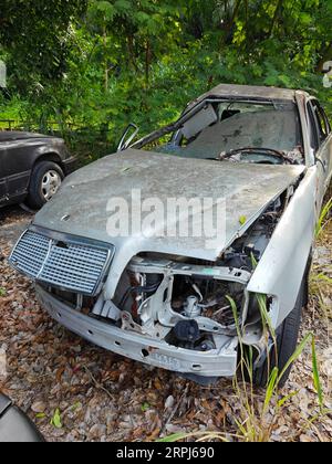 unrecognizable and wrecked cars beyond repair left at the isolated junk ...