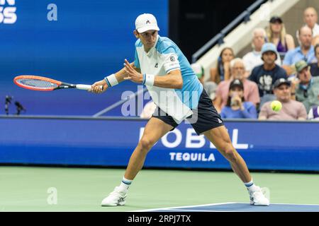 Matteo Arnaldi of Italy returns the ball against Novak Djokovic of Serbia during the Madrid Open ...
