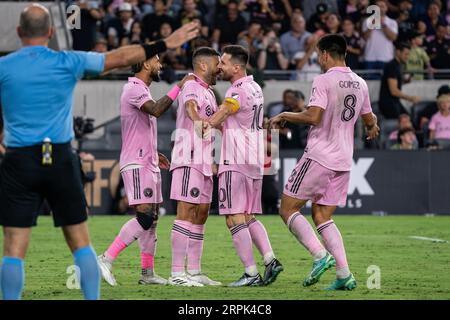 Inter Miami defender Jordi Alba, behind, lifts forward Lionel Messi (10 ...
