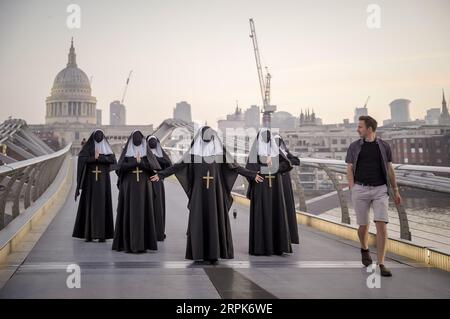 Seven demonic nuns descend upon the Millennium Bridge at sunrise to ...