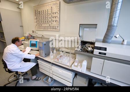 Netherlands, Bilthoven; Laboratory technician analyses the data of a ...