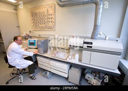Netherlands, Bilthoven; Laboratory technician analyses the data of a ...