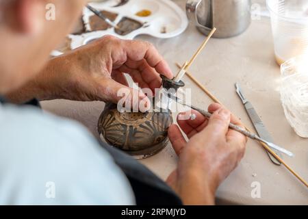 Restoration stage of a ceramic vessel Stock Photo - Alamy