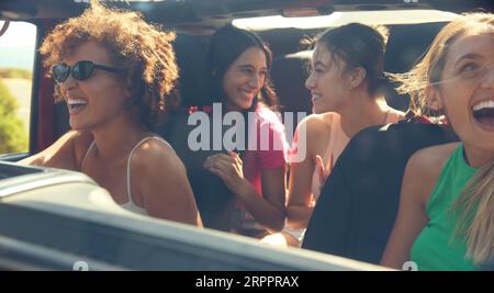 View Through Windscreen Of Group Of Laughing Female Friends Having Fun ...