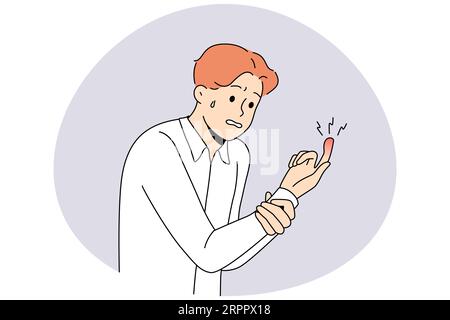 Unhappy man suffer from finger trauma. Unwell guy look at red bruised ...